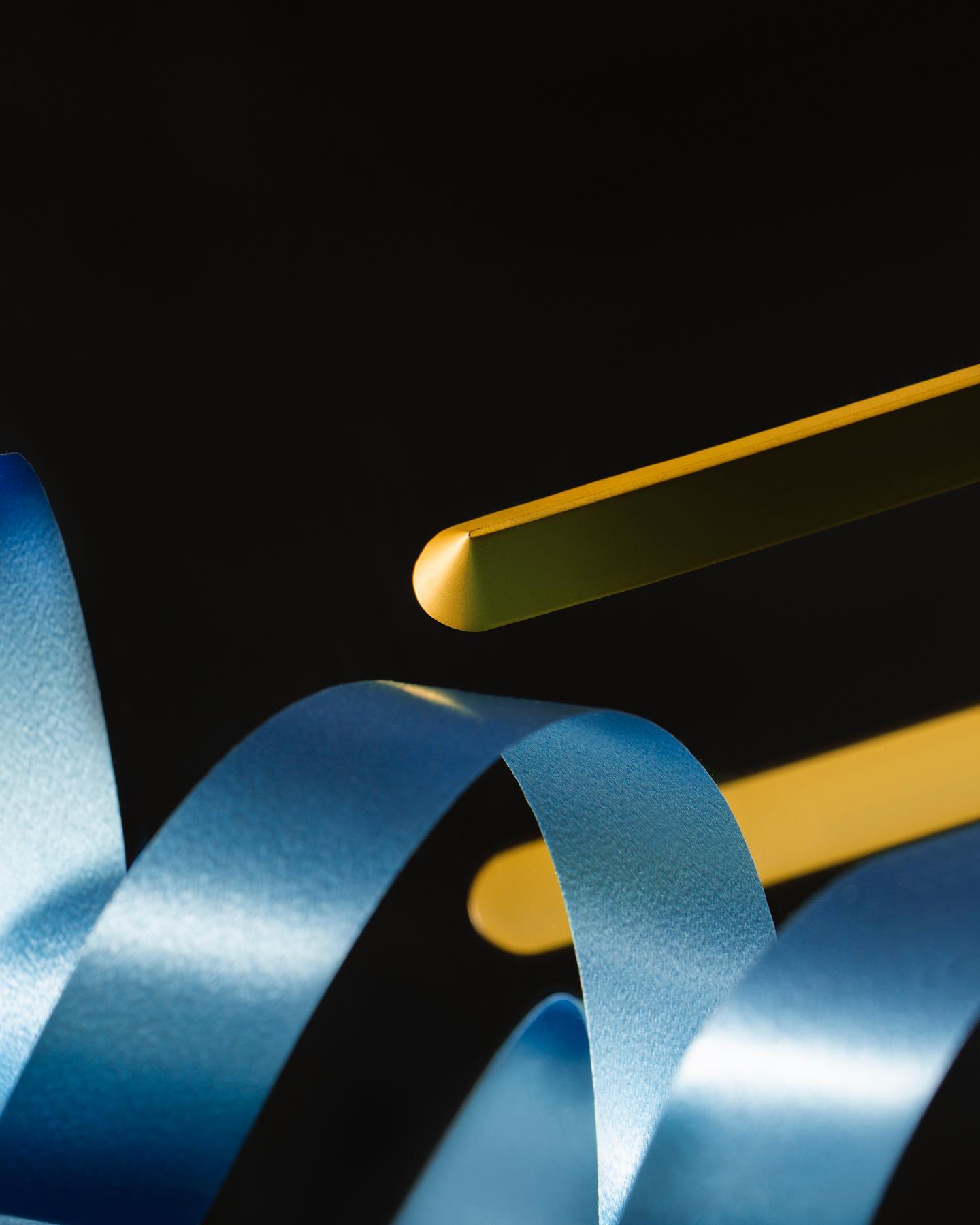 Abstract Blue Yellow Ribbons Black Background