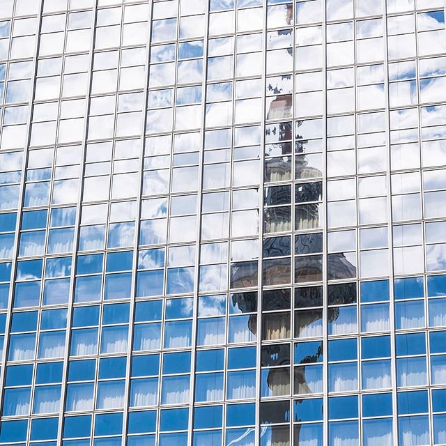 Mirrored Building Reflecting Tower Cityscape