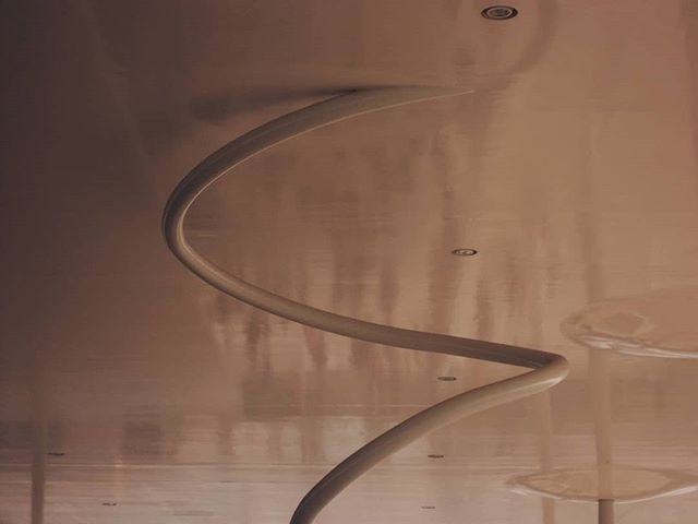 Curved Pipe Fixture Modern Interior Design Glossy Ceiling