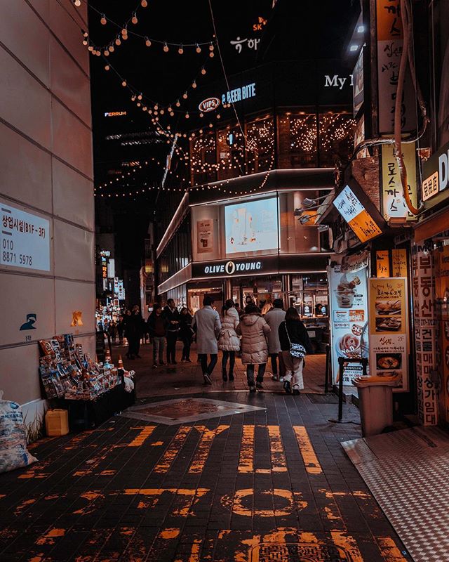 City Street Night Pedestrians Storefronts