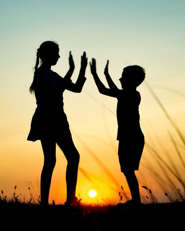 Silhouette Children High Five Sunset Field