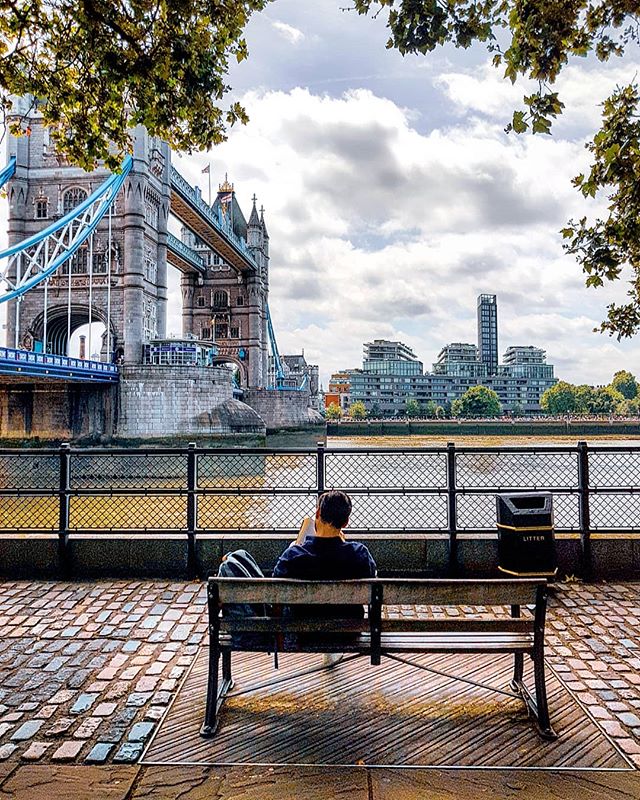 Man Sits On Bench Tower Bridge River Thames London