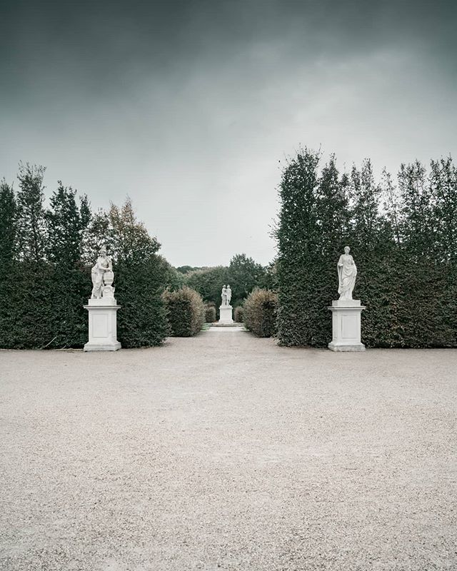 Formal Garden Statues Pathway Serene Scene